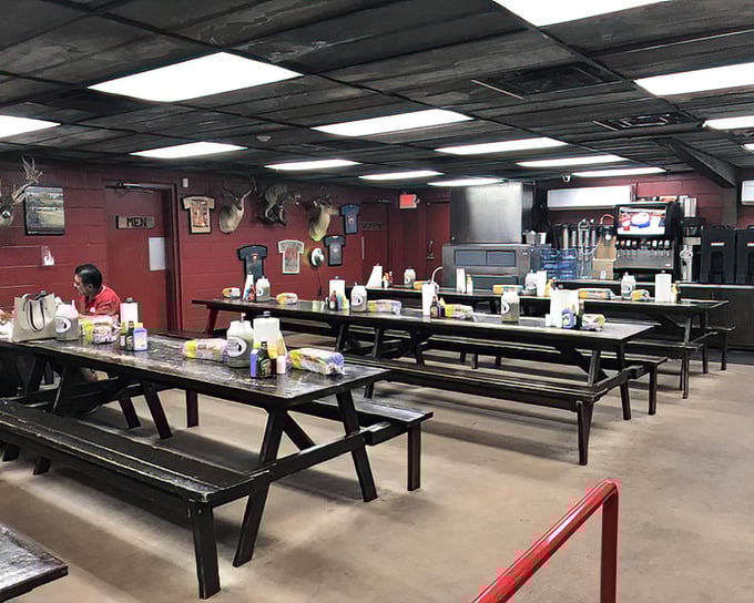 Communal dining at its finest—where strangers become friends over brisket and the taxidermy keeps a watchful eye on your table manners.