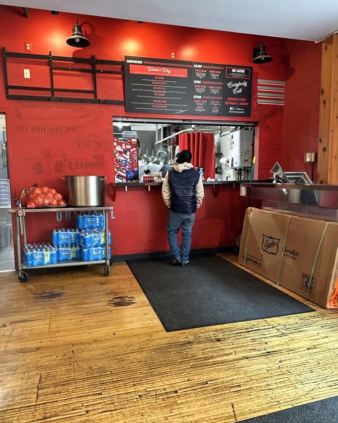 Simple red walls and a no-nonsense menu board—proof that the best places put their energy into the food, not fancy decorations.