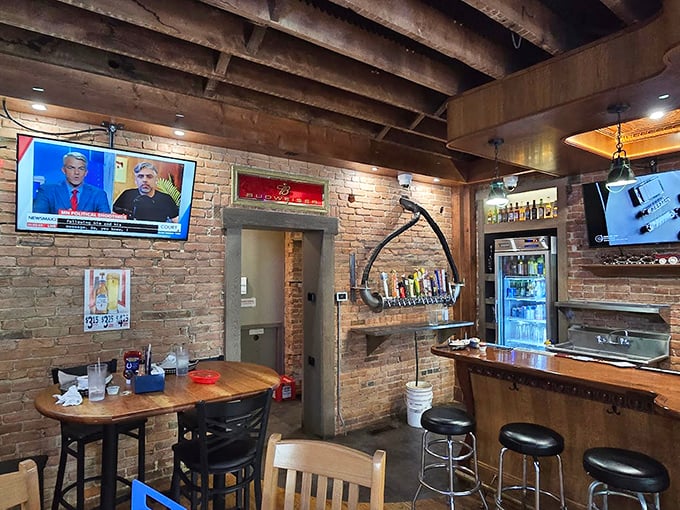 Exposed brick and wooden beams create the perfect backdrop for serious comfort food conversations.