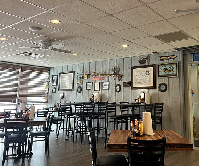 Weathered wood paneling and nautical decor transport you from Ohio to a coastal hideaway. No fake fishing nets here—just authentic maritime charm.