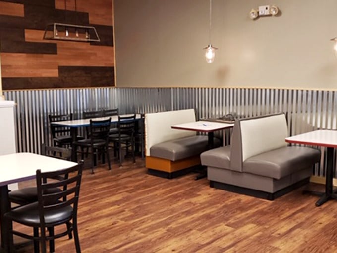 Modern meets nostalgic with corrugated metal wainscoting and comfortable booths—the perfect canvas for serious comfort food consumption.