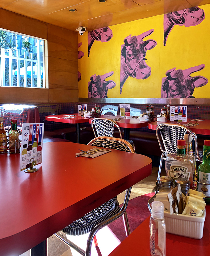 Andy Warhol meets comfort food – those pop art cows on sunshine-yellow walls watch over diners enjoying their meals in retro-cool booths.