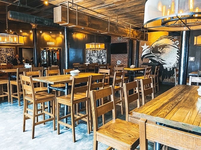 Industrial-chic meets comfort at The Eagle's interior, where wooden tables and exposed brick create the perfect backdrop for culinary magic.