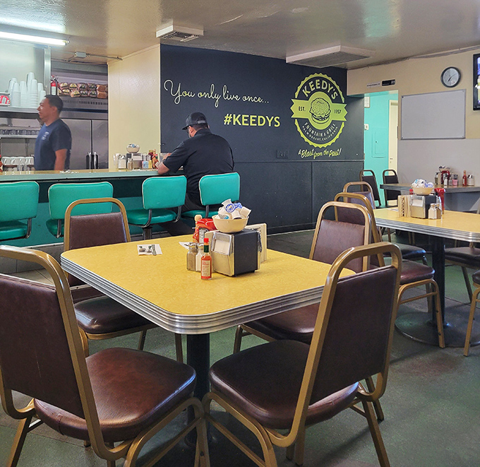 Those turquoise counter stools aren't from a designer catalog—they're time machines that have supported desert locals through countless morning coffees.