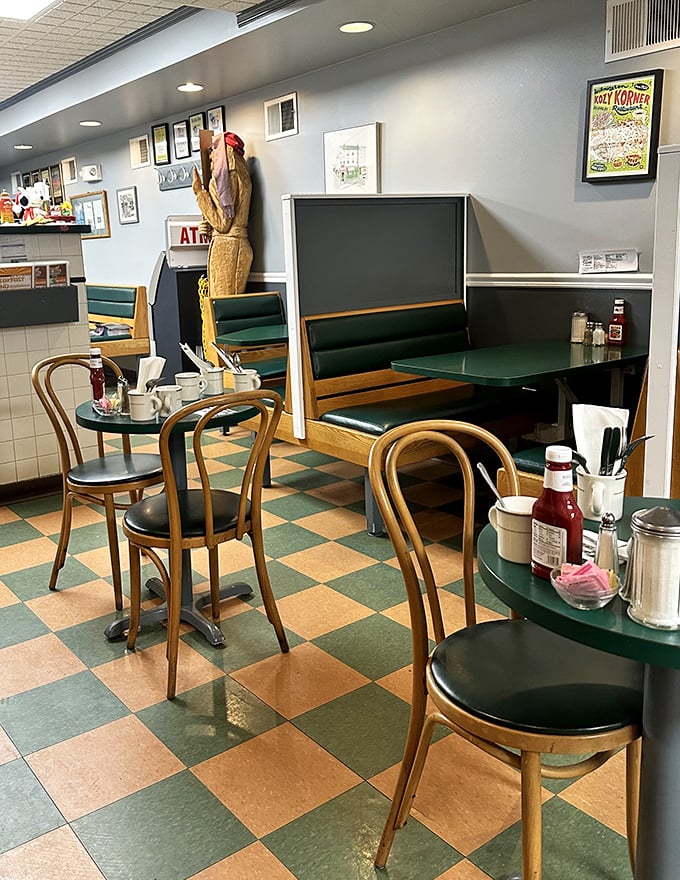 Step inside and time travels backward – classic checkered floors and wooden chairs that have witnessed countless coffee refills and breakfast epiphanies.