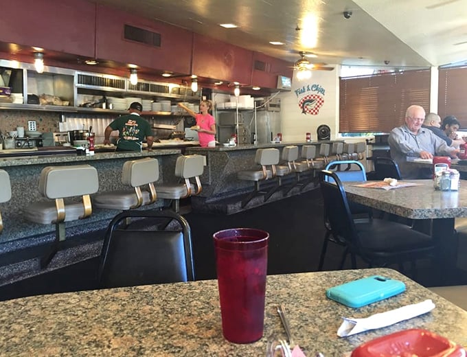 Classic counter seating where magic happens—where strangers become friends and coffee cups are never empty.