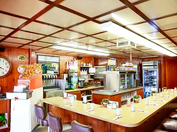 The warm wood-paneled interior with its distinctive counter seating feels like stepping into a time capsule where breakfast is still the most important meal of the day.