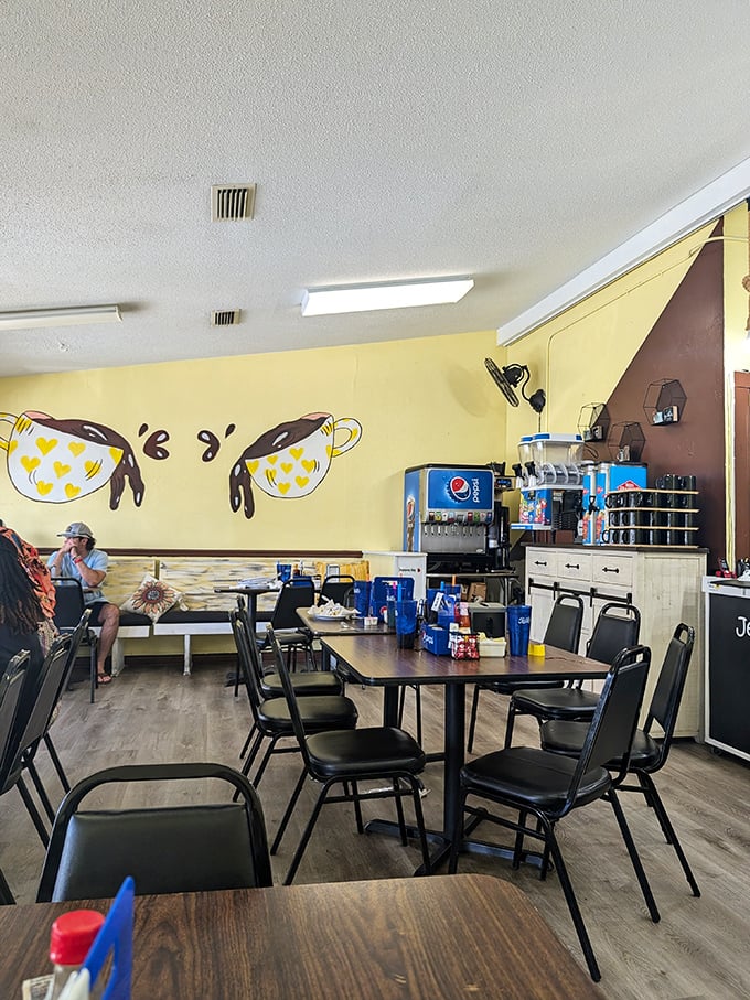 Yellow walls adorned with whimsical coffee cup art create a sunny atmosphere inside, where simple furnishings prioritize the main event: seriously good food. 