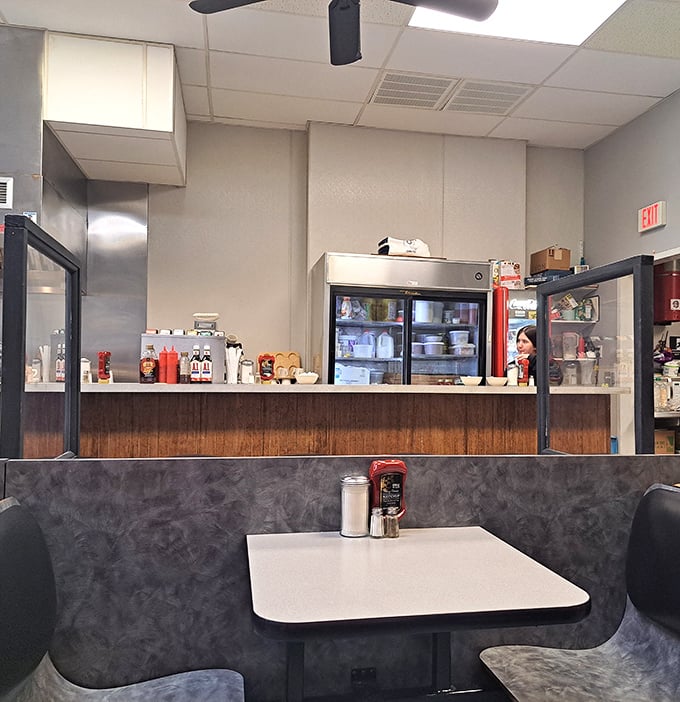 Classic diner booths where countless life decisions have been made over coffee refills. The wood paneling isn't retro – it's authentic, because it never left.