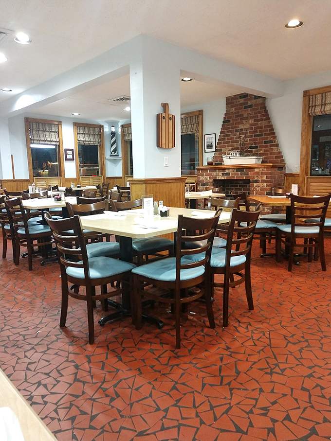 No designer lighting or fancy fixtures here—just honest wood paneling, a brick fireplace, and tables that have hosted countless seafood celebrations.