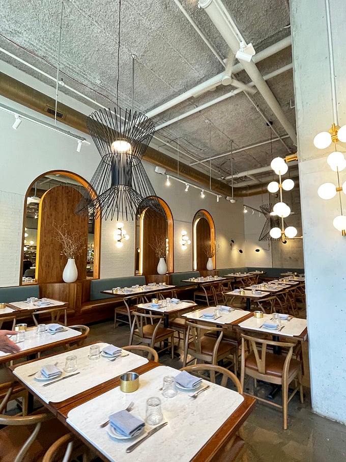 Modern elegance meets cozy comfort in Speck's dining room, where arched wooden accents and stylish lighting create the perfect pasta-eating atmosphere.