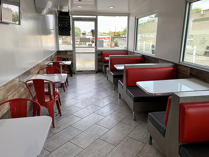 Red vinyl booths and clean simplicity—this isn't interior design following trends; it's the timeless formula for American dining perfection.