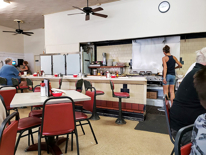 Where the magic happens! The open kitchen and counter seating let you witness breakfast artistry in action while the ceiling fans keep the Florida heat at bay.