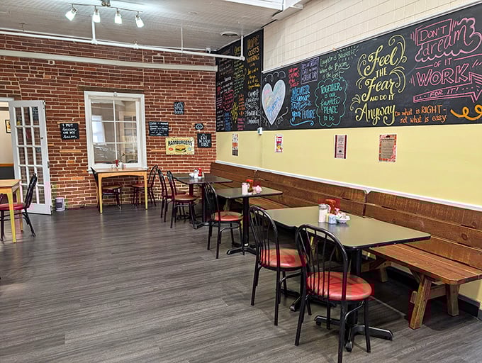 Chalkboard wisdom meets exposed brick in a dining room that feels like the coolest corner of your favorite aunt's kitchen.