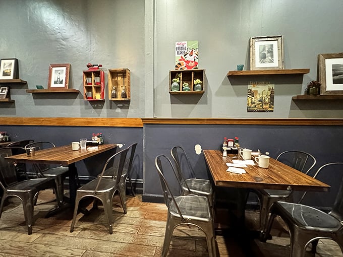 Blue-gray walls adorned with vintage knickknacks create that perfect "neighborhood joint" atmosphere where comfort meets character in every corner.