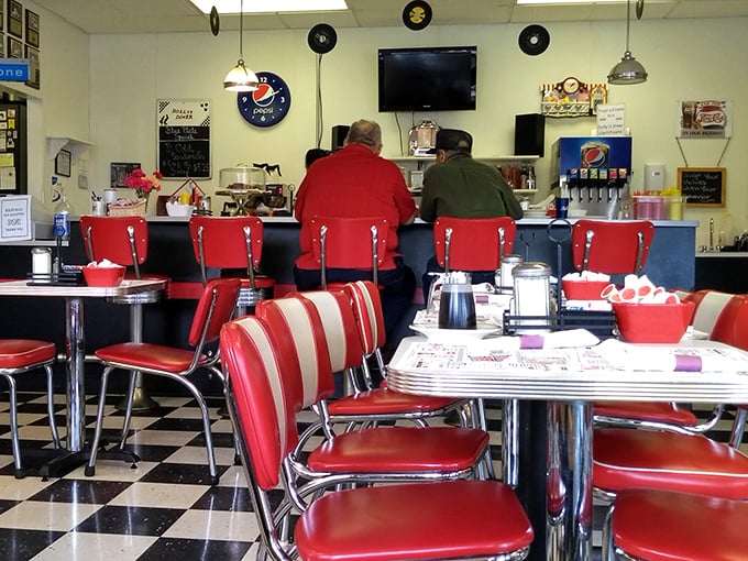 Red vinyl seats and a black-and-white checkered floor—this isn't just a diner, it's a time machine with hash browns.
