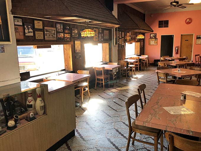 Step inside and time stands still—vintage tile floors, wooden tables, and Tiffany-style lamps create the kind of authentic atmosphere money can't manufacture.