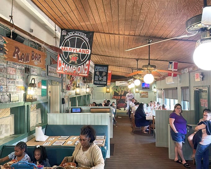 Maryland flags and raw bar signs create the perfect backdrop for your soon-to-be-legendary crab feast adventure.