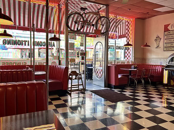 Step inside and the 1950s embrace you like an old friend. That bicycle hanging from the ceiling? It's been defying gravity longer than most diets last.