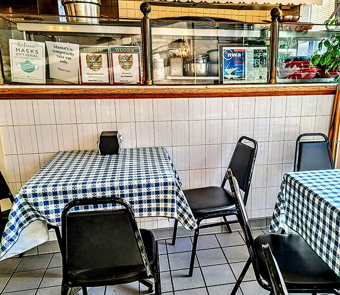Simple blue checkered tablecloths and no-nonsense seating tell you everything you need to know—this place prioritizes substance over style, just as it should.