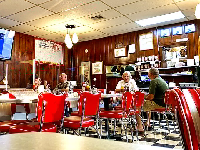 Cherry-red vinyl meets wood paneling in this time capsule of Americana, where conversations flow as freely as the coffee.