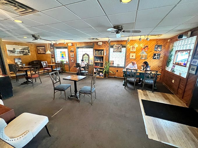 Wood-paneled walls and mismatched furniture create the perfect "grandma's living room meets coffee shop" vibe we didn't know we needed.