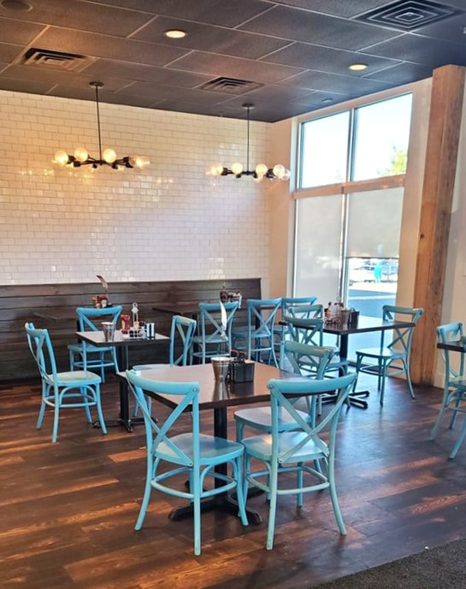 Those turquoise chairs aren't just stylish—they're practically sending you a postcard from breakfast paradise before you even sit down.