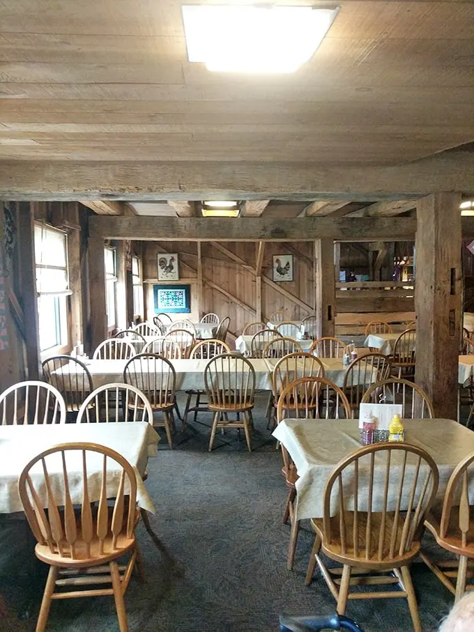 Rustic wooden beams and Windsor chairs create an atmosphere that whispers "slow down and stay awhile." Dining room zen at its finest.