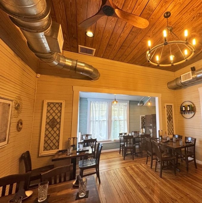 Wooden ceilings, exposed beams, and warm lighting create the feeling you've been invited to dinner at a friend's impossibly stylish beach house.