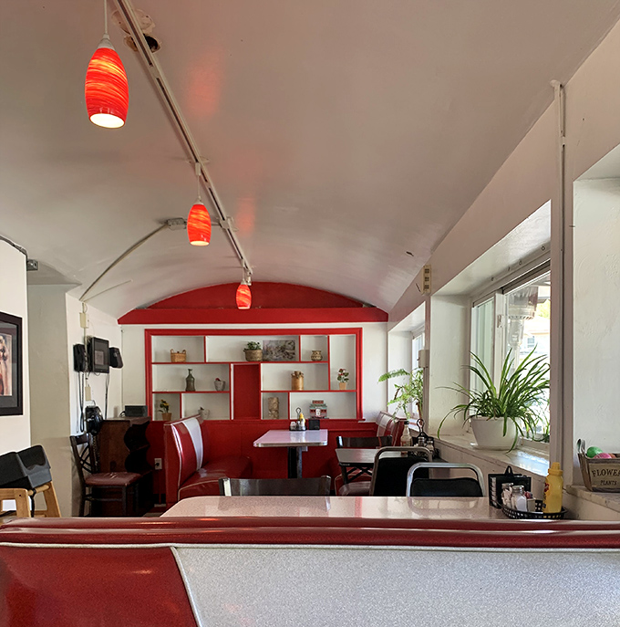 Step inside to a retro wonderland where those vibrant red booths aren't just seating—they're time machines to when diners ruled American cuisine.