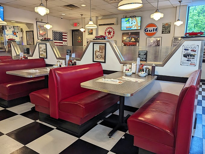 Step inside to a time capsule of Americana—cherry-red vinyl booths, checkered floors, and vintage automotive memorabilia create the perfect backdrop for serious omelette business.