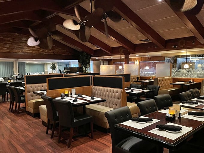 Dark wood beams, comfortable leather booths, and proper lighting—a dining room that understands ambiance isn't about Instagram, it's about conversation.