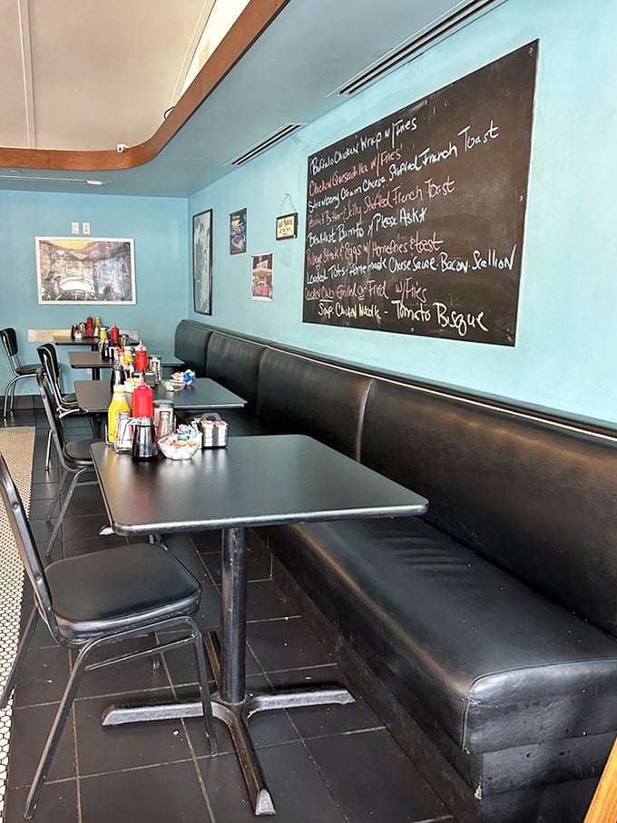 Inside, turquoise walls and black vinyl booths create that perfect diner atmosphere where important decisions—like pancakes versus French toast—are contemplated daily.