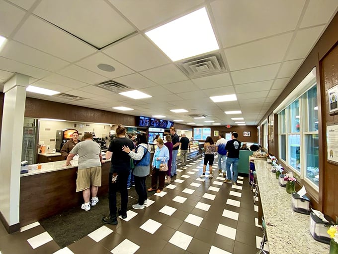The line forms with purpose—a donut democracy where everyone waits their turn for a taste of Centerville's sweetest tradition.