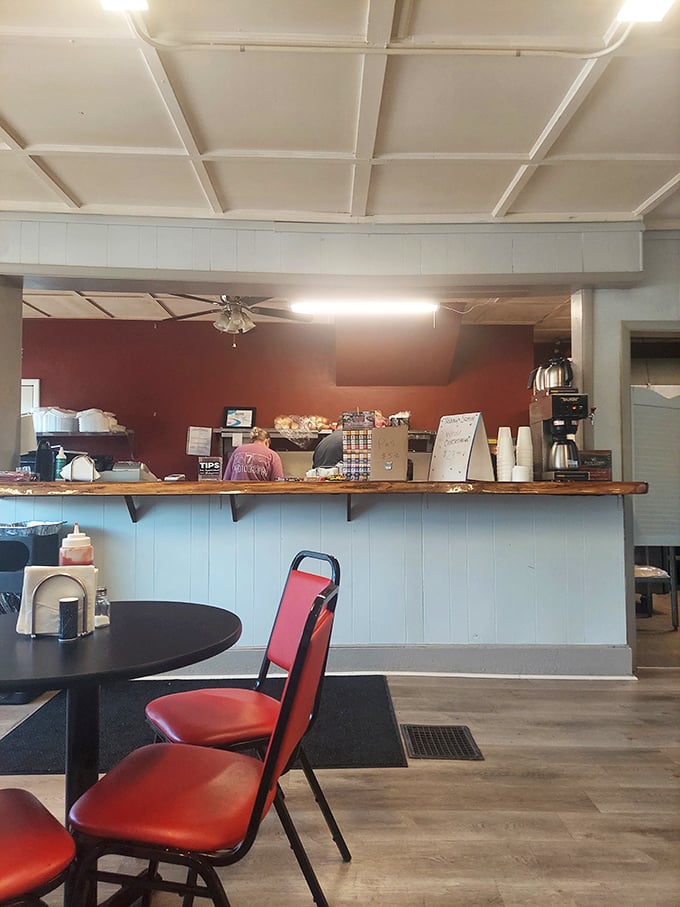Simple red chairs and a no-nonsense counter where sandwich dreams come true. No fancy frills needed when the food does all the talking.