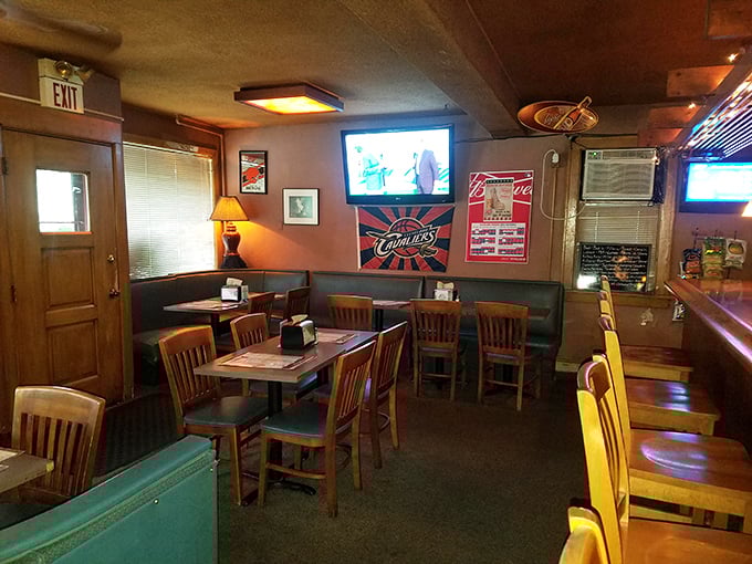 Classic tavern ambiance done right—wood paneling, comfortable booths, and just enough sports on TV to feel connected without shouting over the game.