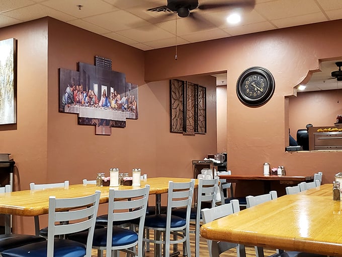Simple wooden tables and warm terracotta walls create the perfect backdrop for food that demands your full attention. The Last Supper artwork seems appropriate—these meals are divine.