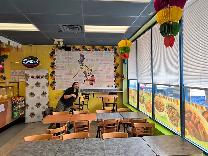 Bright yellow walls, colorful lanterns, and a map of the Philippines create an instant mood lift—visual comfort food before the actual meal arrives.