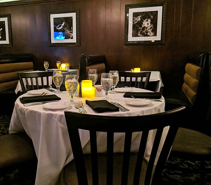 White tablecloths, warm wood paneling, and candlelight create that perfect Italian restaurant atmosphere where memories are made between bites.