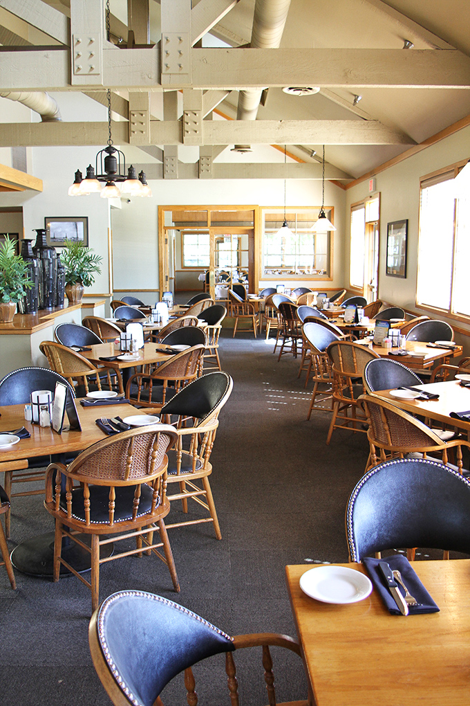 High-beamed ceilings and warm wood tones create an atmosphere where time slows down and conversations flow as freely as the wine.