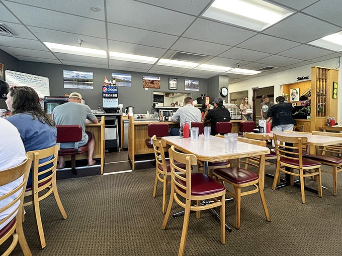 The breakfast battlefield where decisions are made and friendships tested—wooden chairs await while the counter beckons to solo diners and coffee enthusiasts.