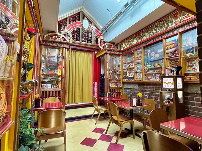 Step inside and you've entered hot dog Narnia—part vintage burlesque museum, part comfort food haven. The checkered floor says "classic diner," but those display cases whisper "hidden treasure."