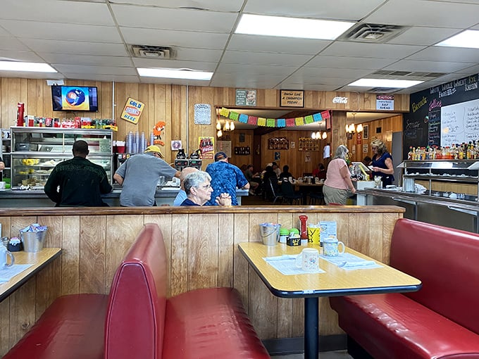 Classic Americana in its purest form: wood paneling, red vinyl booths, and conversations that matter. No Instagram filters needed in this time capsule of comfort.