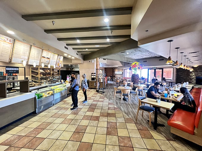 Inside, the warm wood tones and terra cotta tiles create a space that's both modern and cozy—like your stylish friend's kitchen, but with better food.