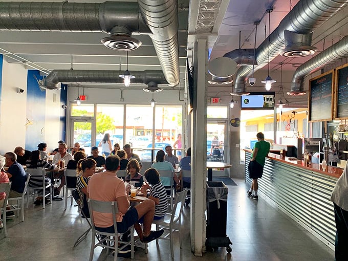 Inside, it's all business – exposed ductwork, simple seating, and a counter where seafood dreams come true. No ocean view needed when the food is this good.