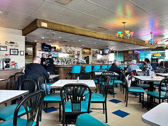 Where Old Style signs meet turquoise chairs, and pizza legends are born. This isn't décor – it's a time machine to when restaurants were about food, not Instagram.