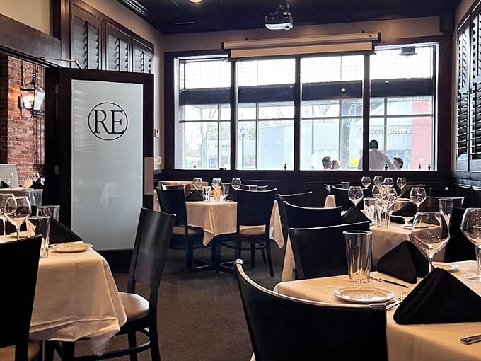 White tablecloths, dark wood, and that perfect lighting that makes everyone look like they've just returned from vacation—Rick Erwin's dining room nails the upscale-yet-comfortable vibe.
