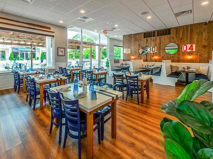 Warm wood tones and nautical blues create the perfect backdrop for seafood feasting. The dining room balances coastal charm with modern comfort—no kitschy fishing nets in sight!