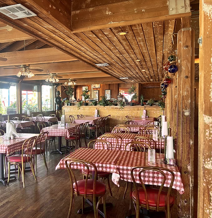 Red and white checkered tablecloths set the stage for maritime memories, where wooden beams overhead have witnessed countless "oohs" and "aahs" over perfect bites. 