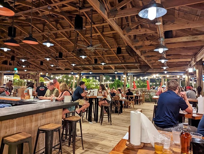 Where exposed wooden beams frame conversations as perfectly as they frame the Tampa Bay sunset—Florida dining in its natural habitat.
